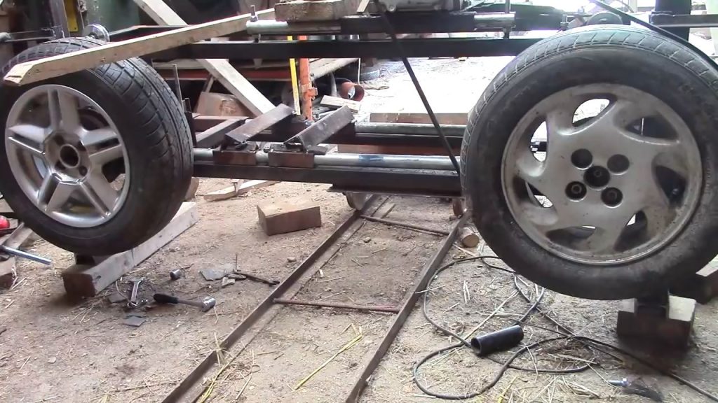 How to build a Simple Homemade Bandsaw Mill from Old Car Wheels